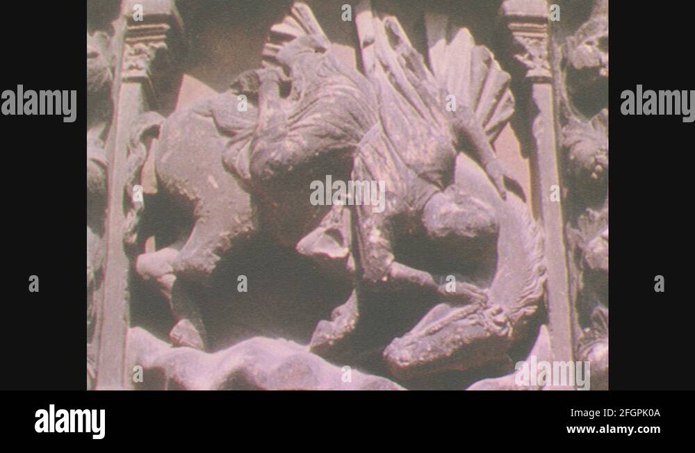 France 1960s: Architectural carving of man falling from horse. Statue ...