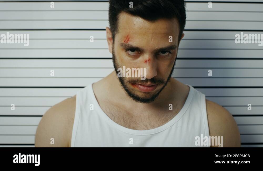 In a Police Station Arrested Beaten Man Poses for Side, Front View ...