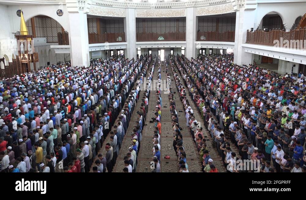 Congregation of Malaysian Muslim men praying in mosque Kuala Lumpur ...