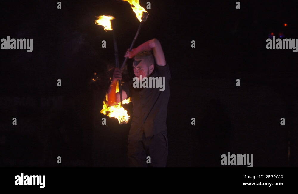 Fiery dance. Amazing magical Fire Show at night. Slow shutter speed ...