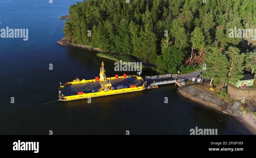 Ferry docking, Cinema 4k aerial view of a car ferry docking at a harbor ...