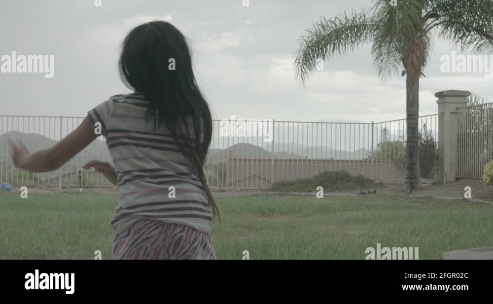 4K cute asian girl back side dancing hip hop floss dance move outdoor ...