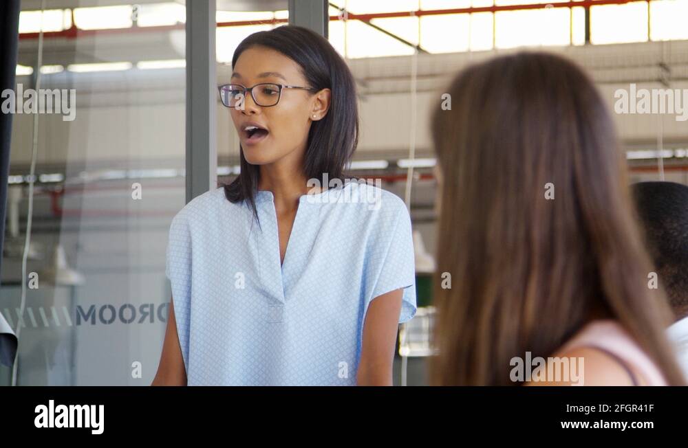 Young black woman addressing colleagues at business meeting Stock Video ...