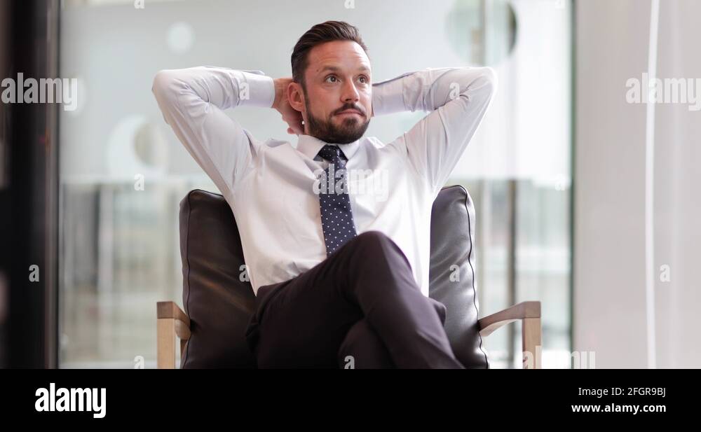 Leaning back chair Stock Videos & Footage - HD and 4K Video Clips - Alamy