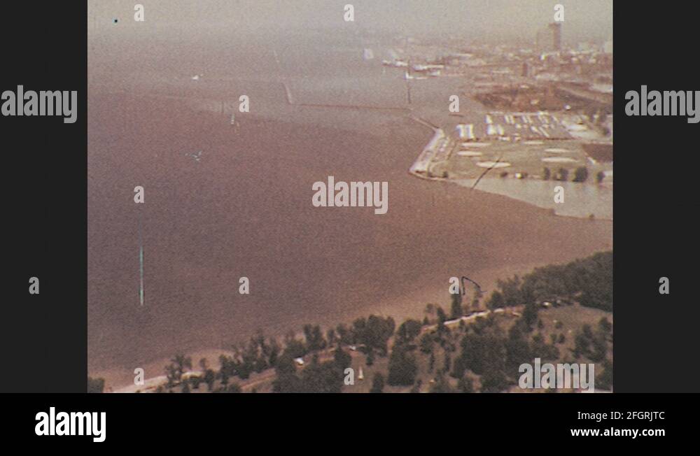 1970s: UNITED STATES: smog over city buildings. Pollution in rivers ...