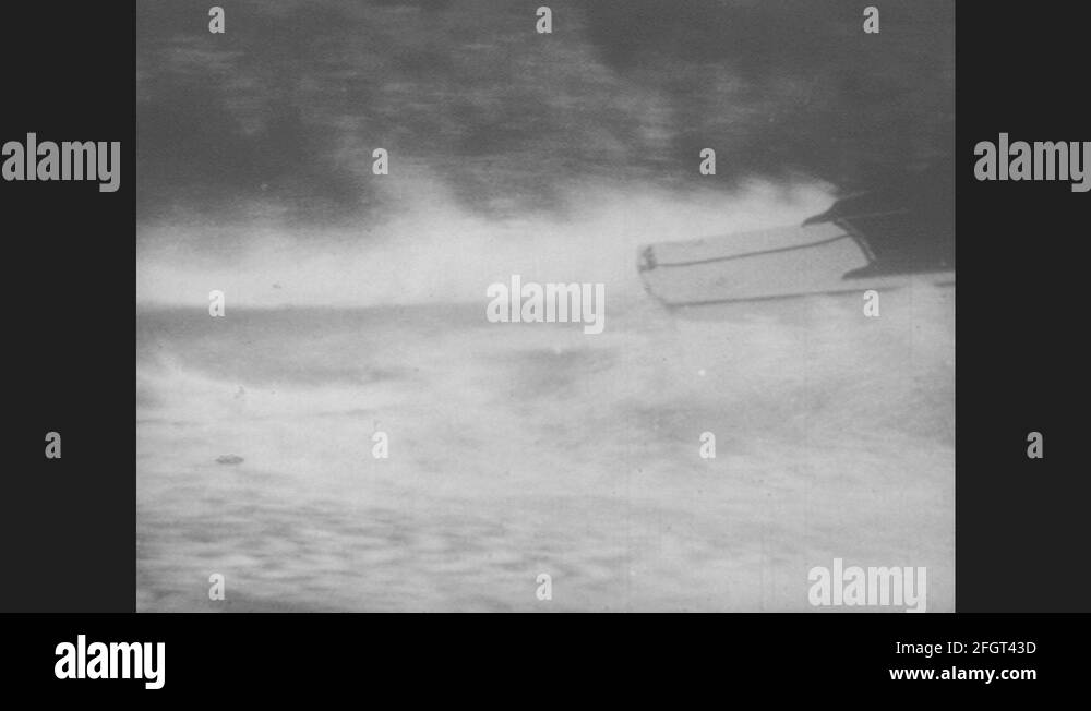 1950s: Speed Boat. Boy Swimming In Wake Of Boat. He Grabs Canoe And ...