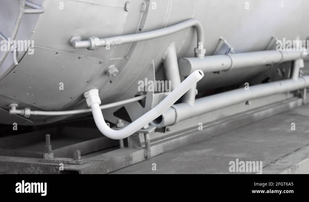 Steaming pipe protruding from a tank Stock Video Footage - Alamy