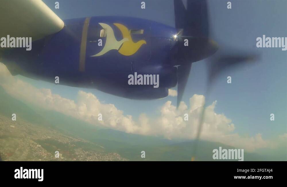 Plane Propeller Spinning While Flying Above Mountains - Slide - Left To ...