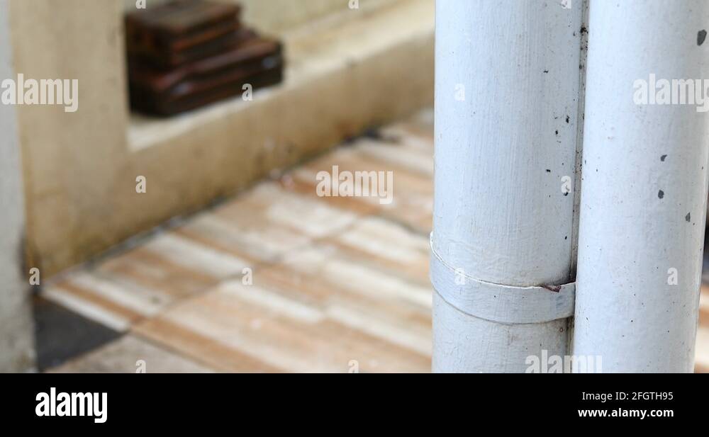 rain water flowing in tube pipe drain from gutter roof house Stock ...