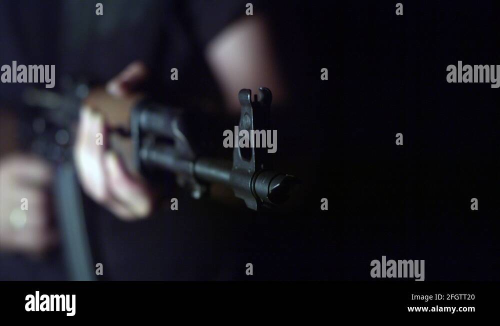 Person shooting a rifle in slow motion Stock Video Footage - Alamy