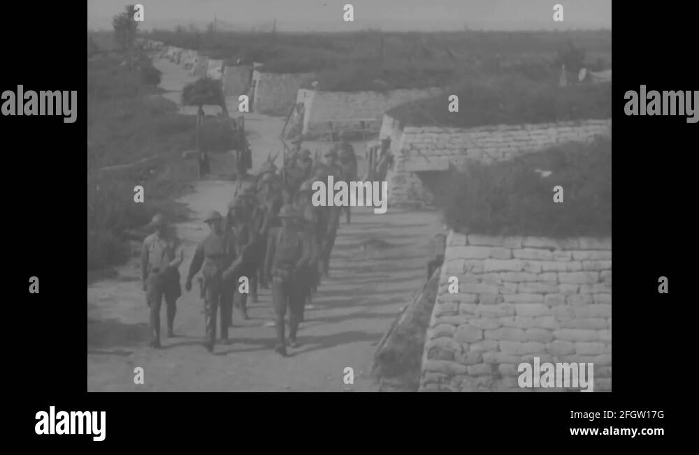 WW1 - US trooper walk behind defense wall Stock Video Footage - Alamy