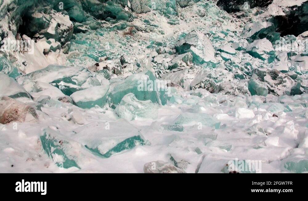 Turquoise color glacier on background of snow in Arctic Stock Video ...