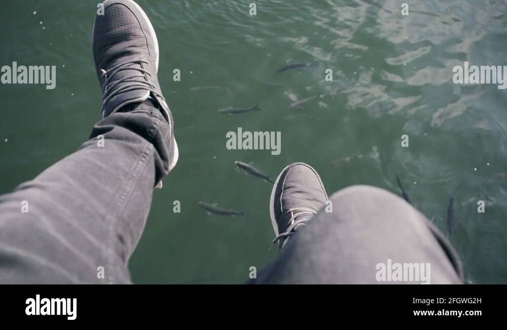 Perspective of a pair of smart shoes sneaker being worn by a man ...