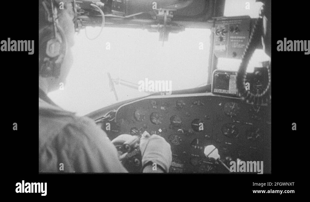 1950s: Pilot in cockpit. Plane flies in thick clouds and storm ...