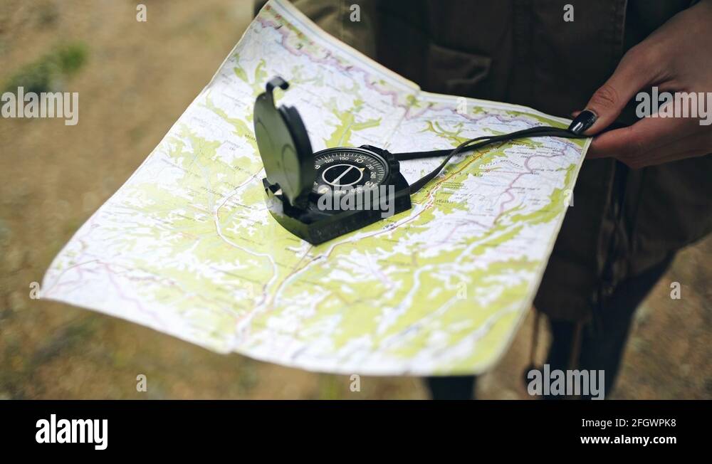 Woman map compass Stock Videos & Footage - HD and 4K Video Clips - Alamy
