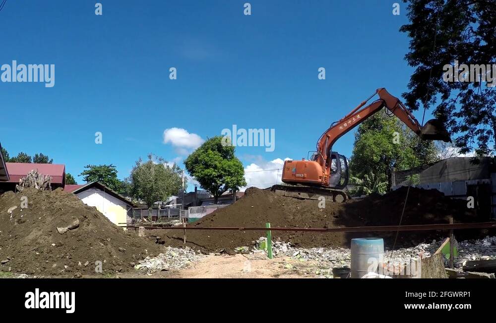 backhoe loader bucket excavator digging soil Stock Video Footage - Alamy