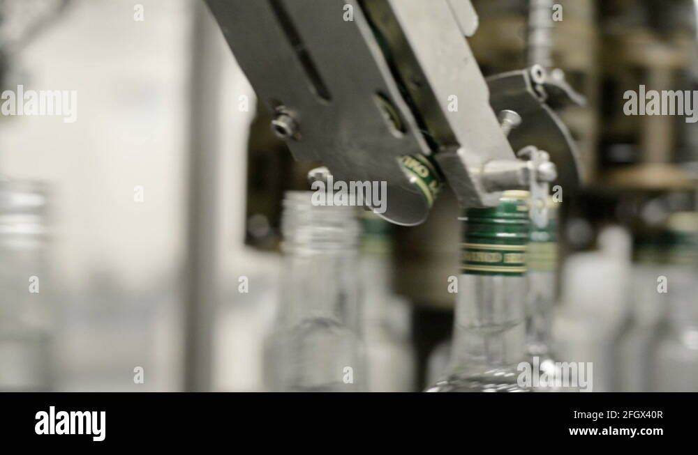 The mechanism of the automatic bottle capping machine Stock Video ...