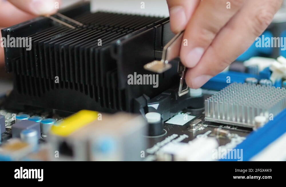 Removing And replacing CPU cooler on modern PC computer motherboard ...