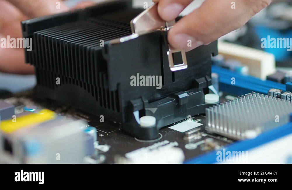 Removing And replacing CPU cooler on modern PC computer motherboard ...