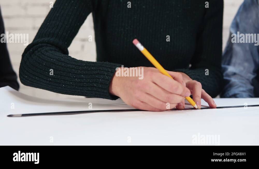 Multiethnic group of people working together drawing a plan using ...