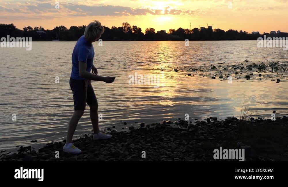 Boy throwing stone into water Stock Videos & Footage - HD and 4K Video ...