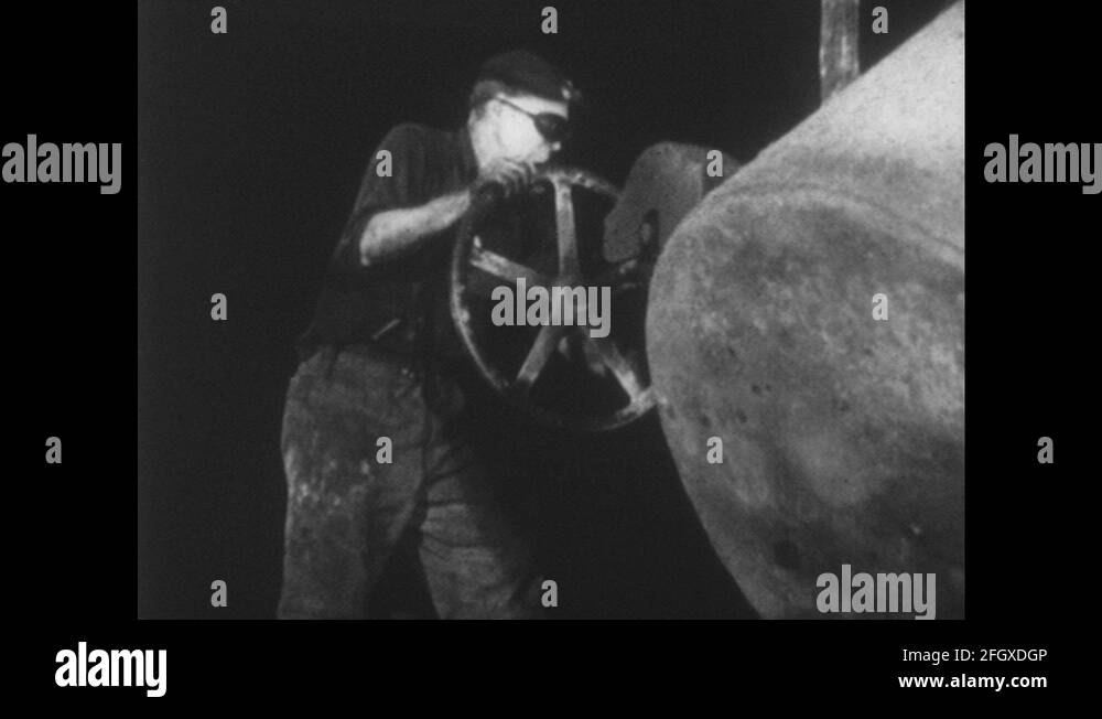 1940s: UNITED STATES: workers in factory. Ammunition factory at work ...