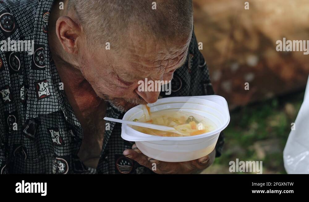 Poor man eating Stock Videos & Footage - HD and 4K Video Clips - Alamy