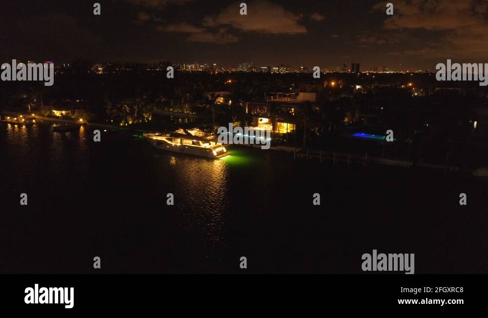 Luxury Miami Beach yachts and mansions at night Stock Video Footage - Alamy