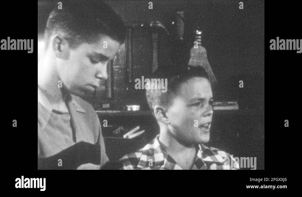 1950s: Two boys talk angrily. One boy talks and looks scared. Students ...