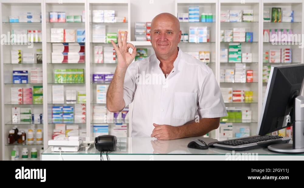 Chemist Image Smiling Make Ok Sign Good Job Hand Gestures in a Pharmacy ...