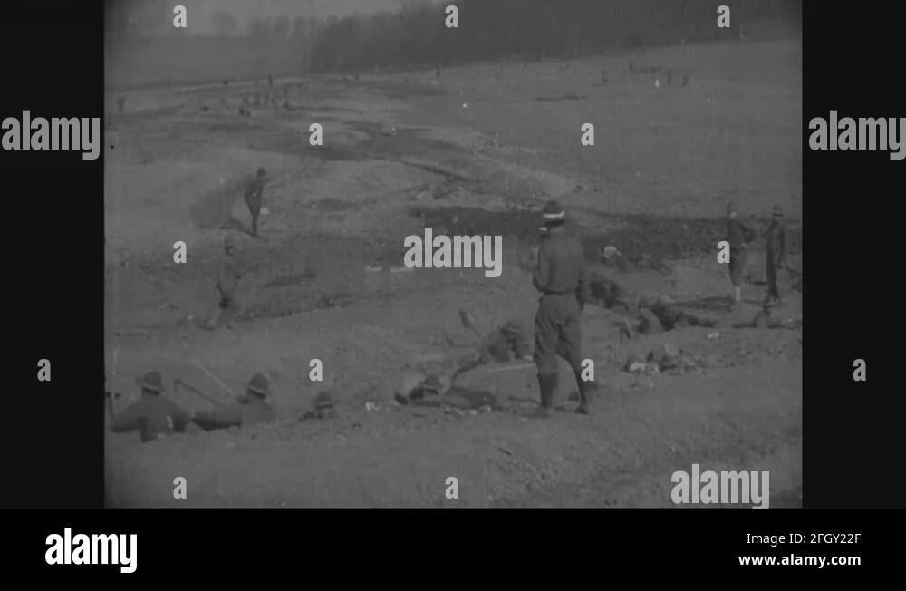 Enlisted men in the field dig trenches - 1917-1918 Stock Video Footage ...