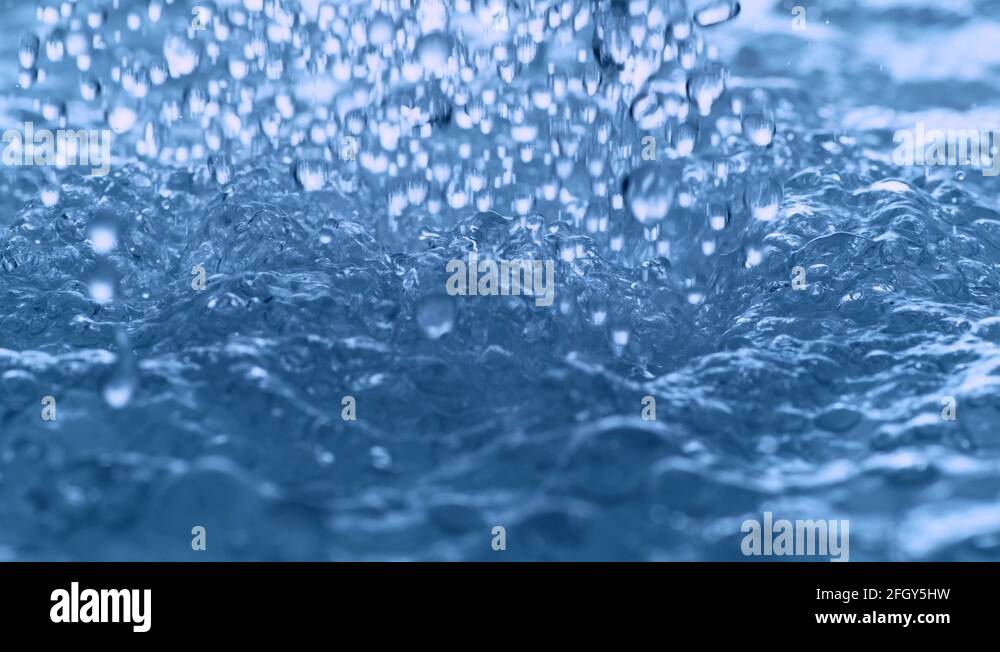 Rain Drops Falling in Slow Motion - Droplets Hitting a Water Surface ...