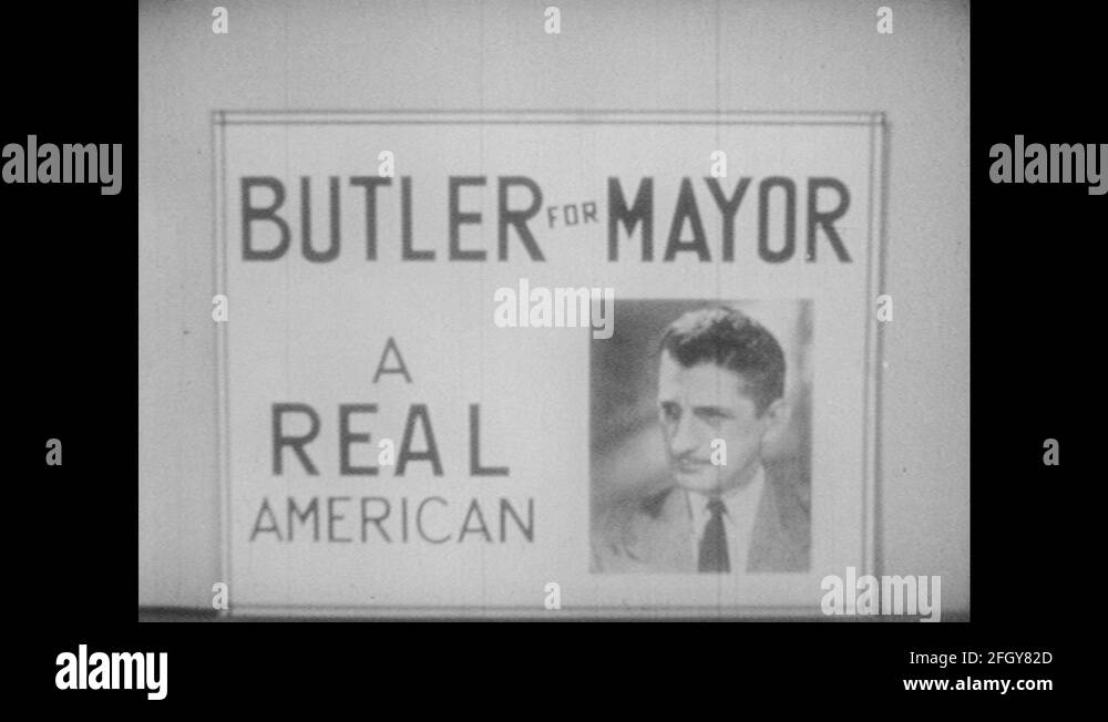 1940s: Sign: Butler for Mayor. Hand replaces words to change the sign ...