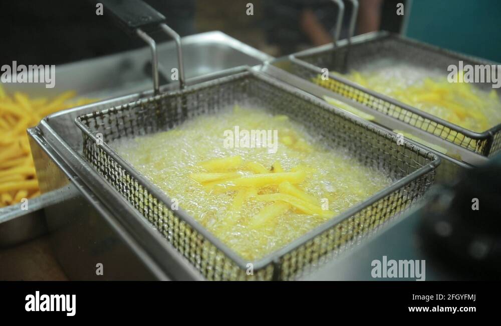 Process of cooking French fries in the deep fryer Stock Video Footage ...
