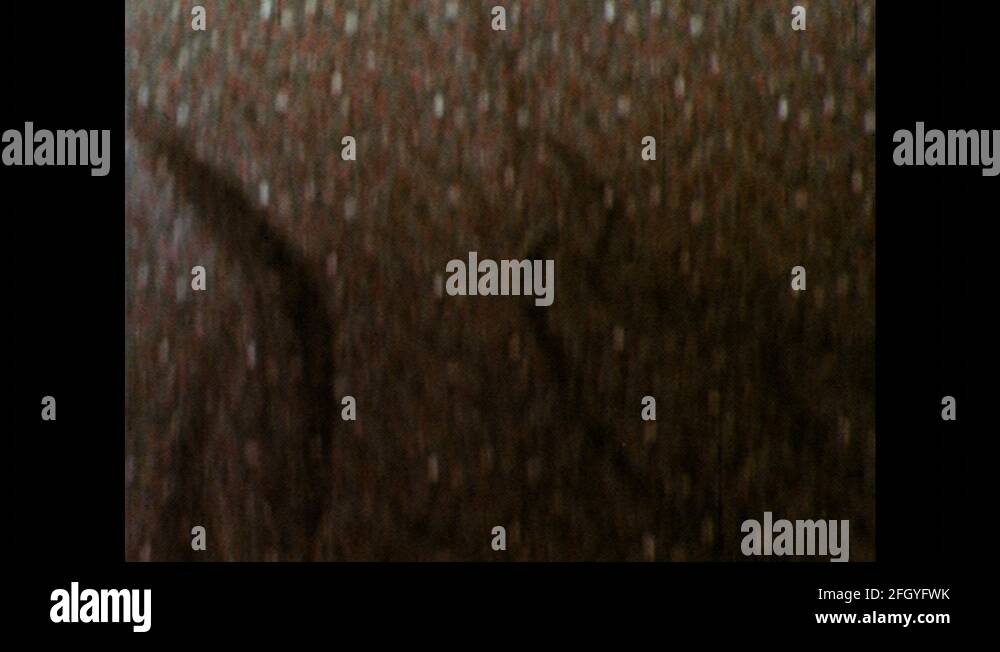 1960s: Cloth moving. Child slides down bumpy playground slide. Luggage ...