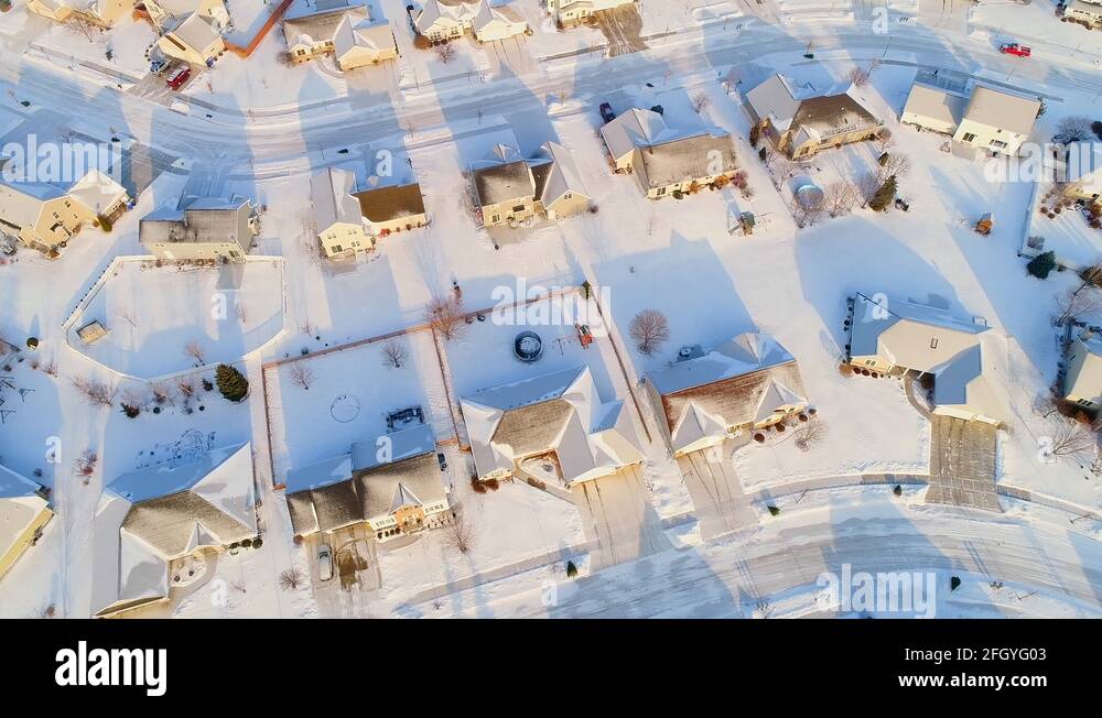 Beautiful neighborhoods, homes frozen under snow and ice, aerial view ...
