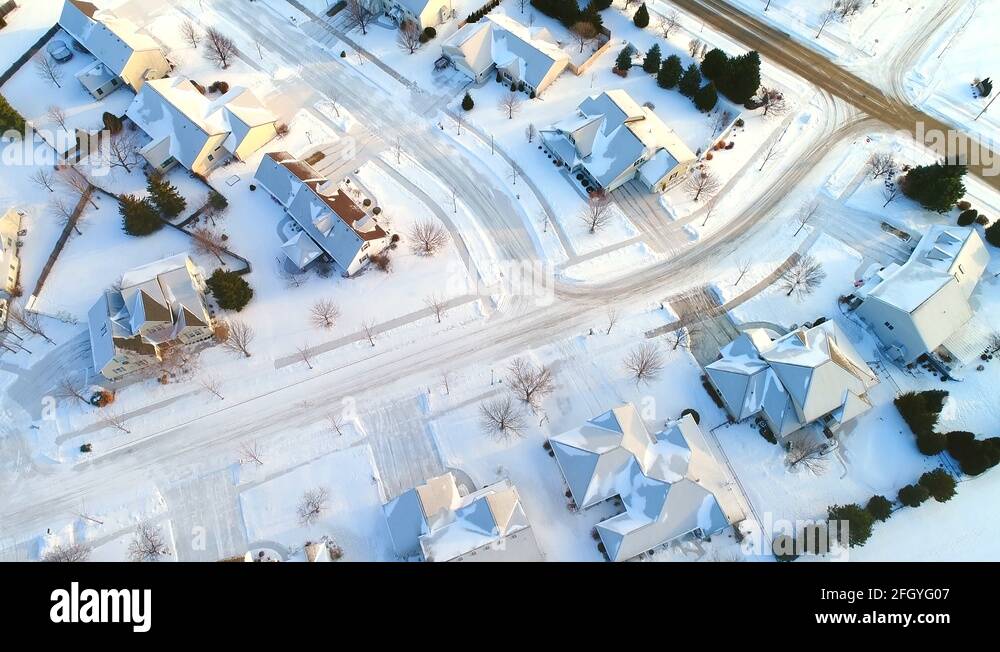 Beautiful neighborhoods, homes frozen under snow and ice, aerial view ...