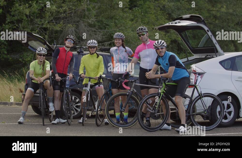 Group of cyclists pose for group photo. Fully released for commercial ...