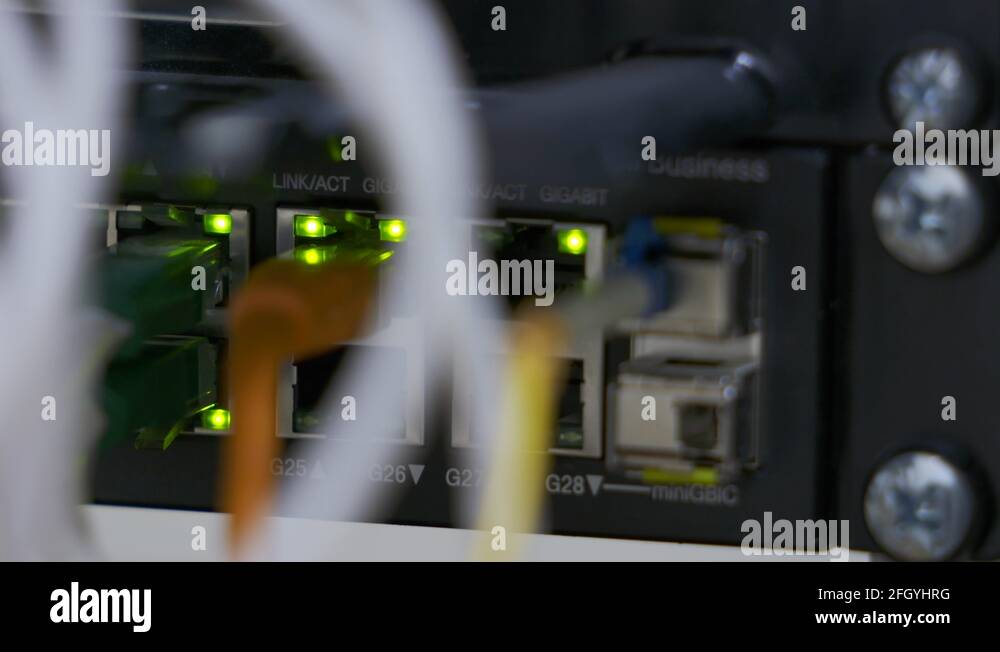 Network cables connected to a hub in server room at the data centre ...