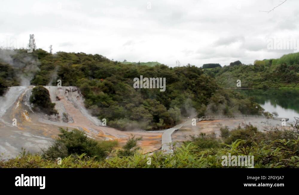 Geothermal landscape with hot springs and steam from geysers. New ...