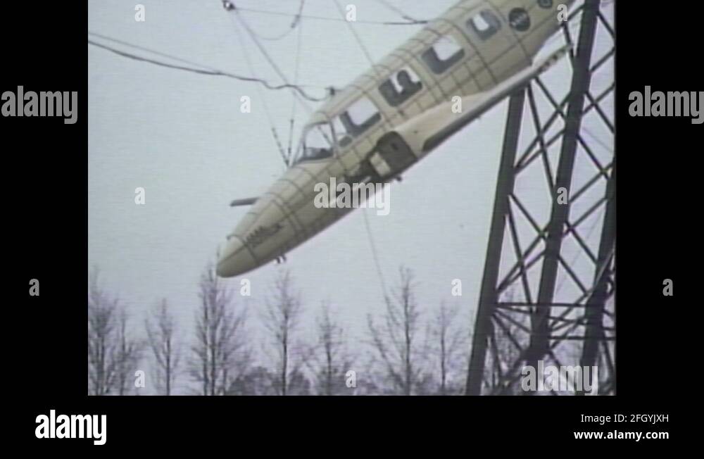 1970s: Light aircraft is suspended by cables, moves forward, gets ...