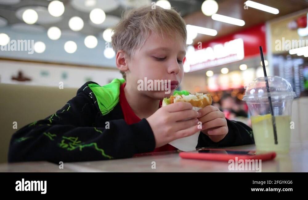 Child eating hamburger Stock Videos & Footage - HD and 4K Video Clips ...
