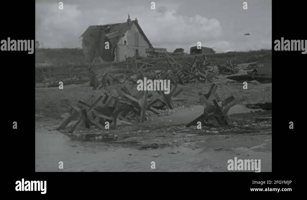 WW2 - D-Day - View of tank barrier and destroyed building in Normandy ...