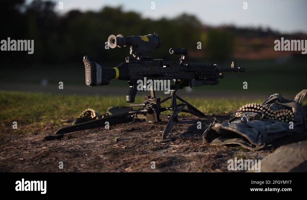 Empty shell casings falling on the ground, fired from machine gun ...