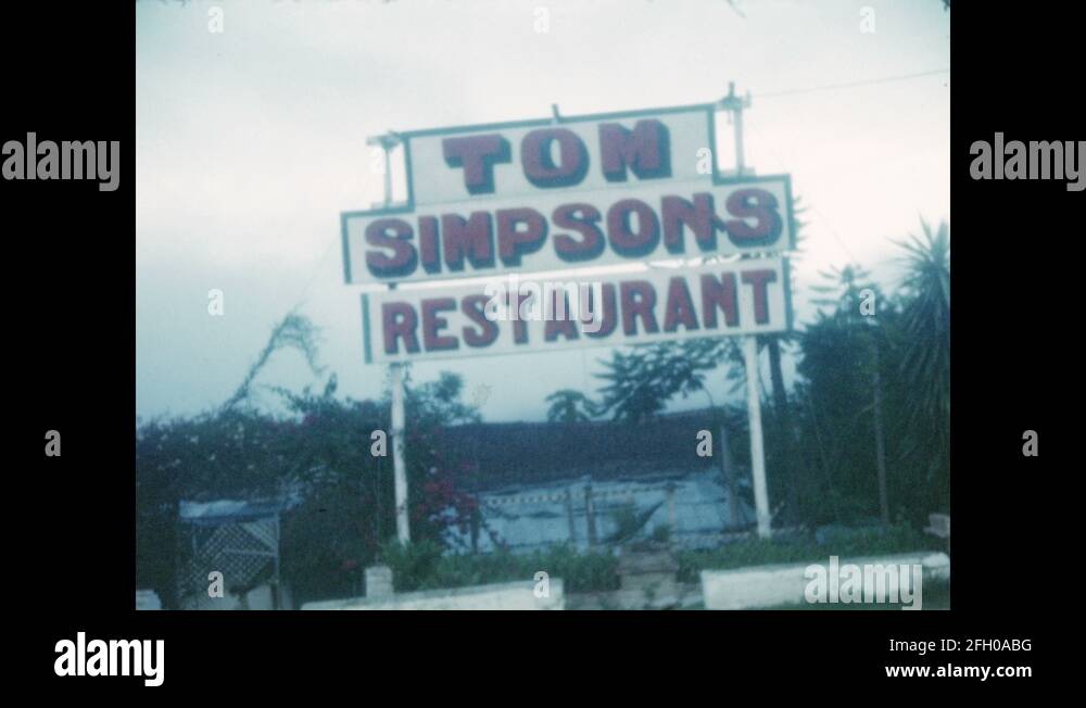 1940s: MEXICO: Tom Simpson's Restaurant sign. Pink flowers in garden ...