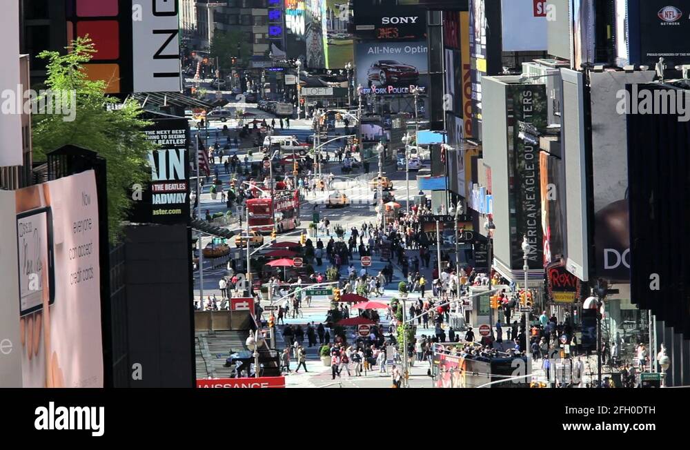 Times Square in New York city on a busy sunny day, Manhattan, North ...