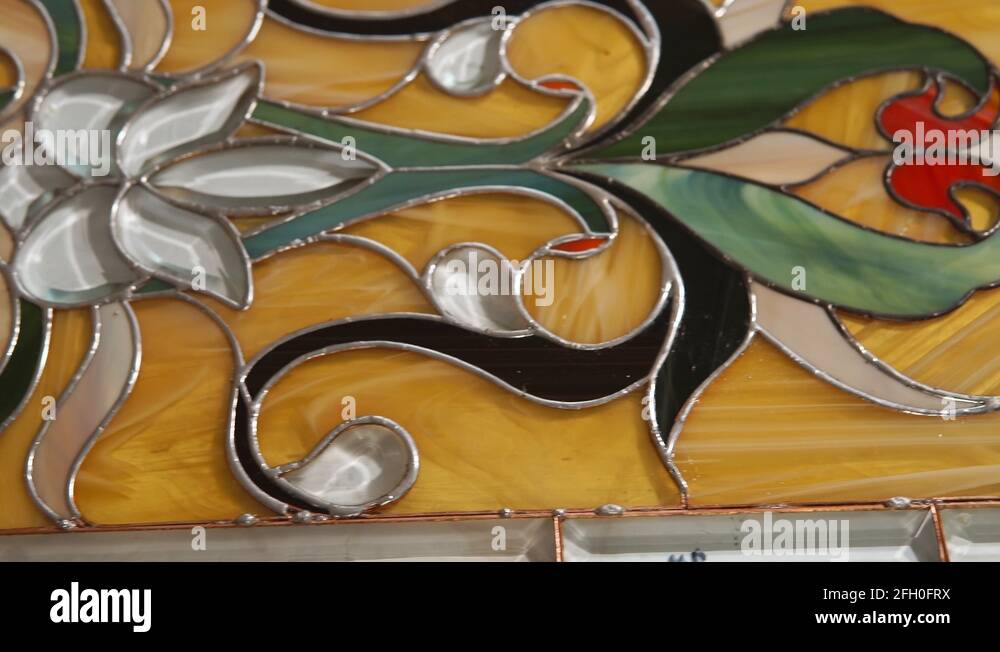 close up shot of a stained glass window, which is executed in a colored ...