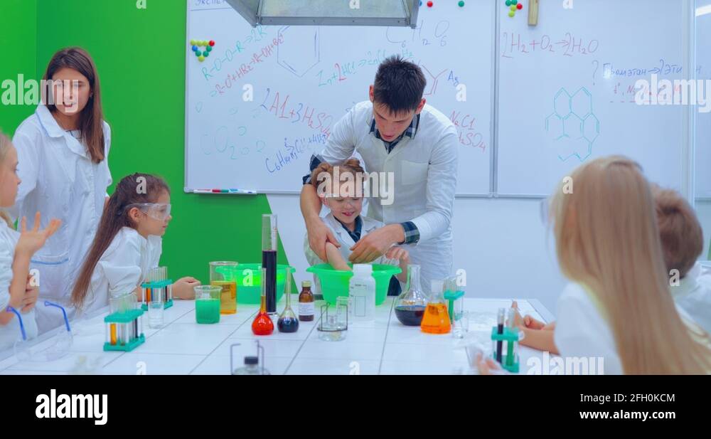 Teacher showing experiment how fire burning on their hands. Teacher ...