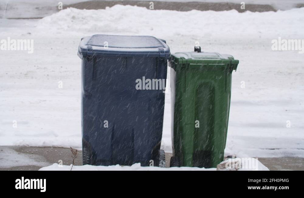 Recycling and garbage bins on sidewalk in snow. No logos. Toronto ...