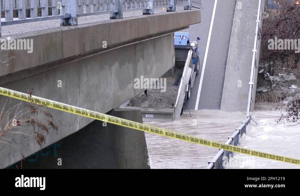 Bridge collapses into river during severe storm and flash flooding ...